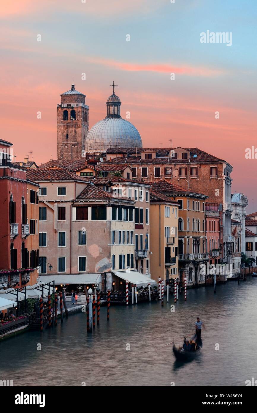 Venice grand canal sunset view with Gondola and historical buildings ...