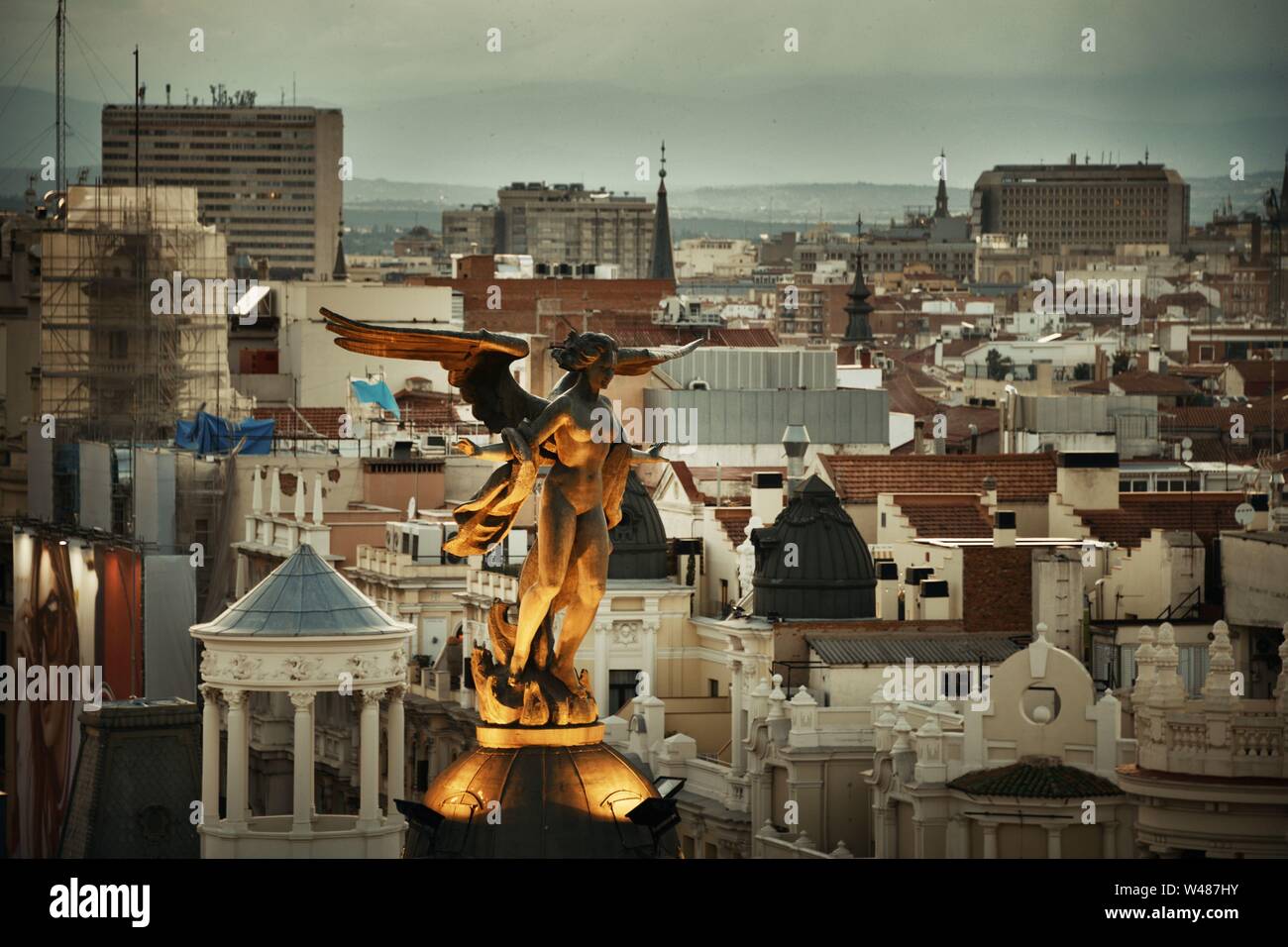 Madrid skyline rooftop view with angel statue and buildings in Spain ...