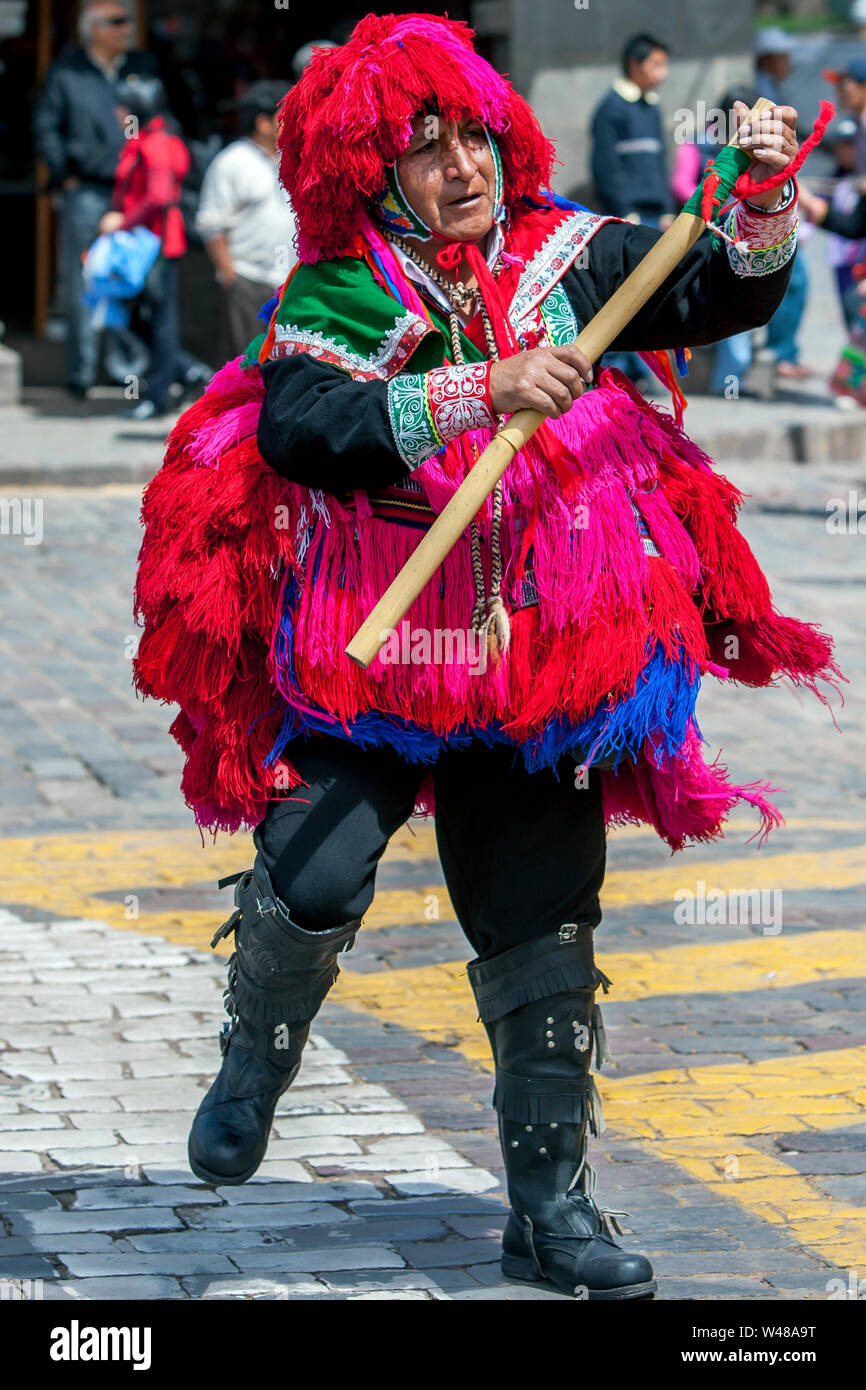 A male performer in colourful Peruvian costume dancing at Plaza de ...