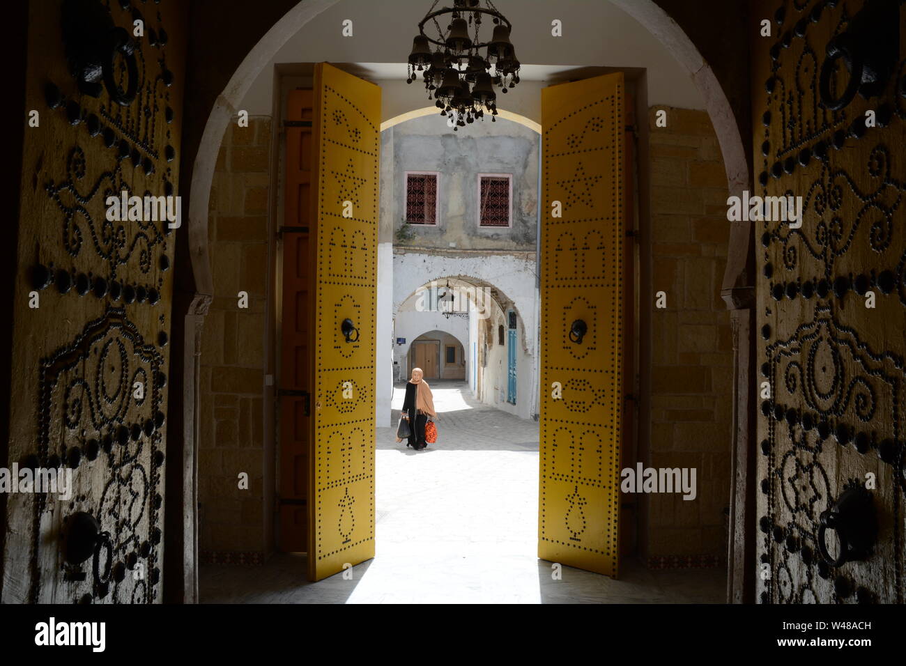 Looking out of traditional, decorated, double doors in a 17th century ...