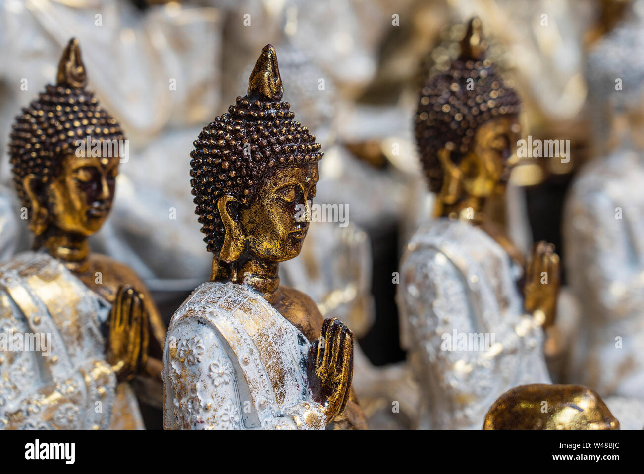 Buddha statue figures souvenir on display for sale on street market in ...