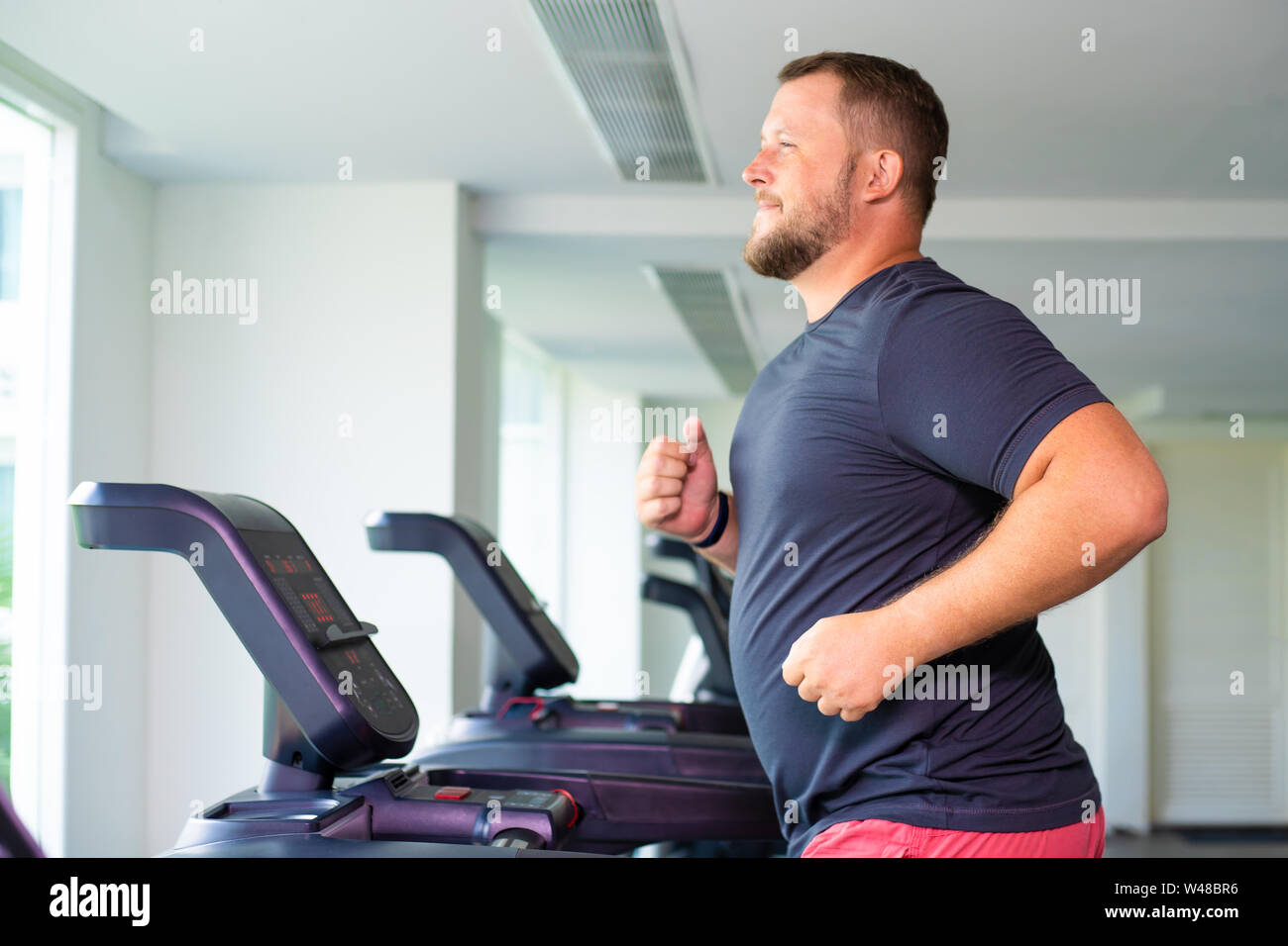 Fat Man On Treadmill High Resolution Stock Photography and Images - Alamy