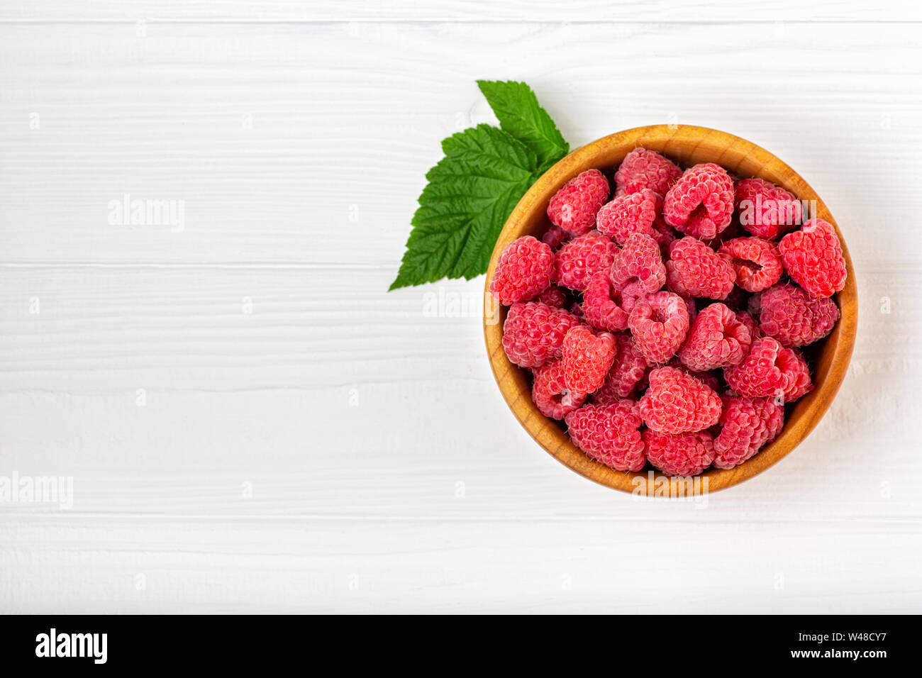 top view of raspberries in bowl Stock Photo - Alamy