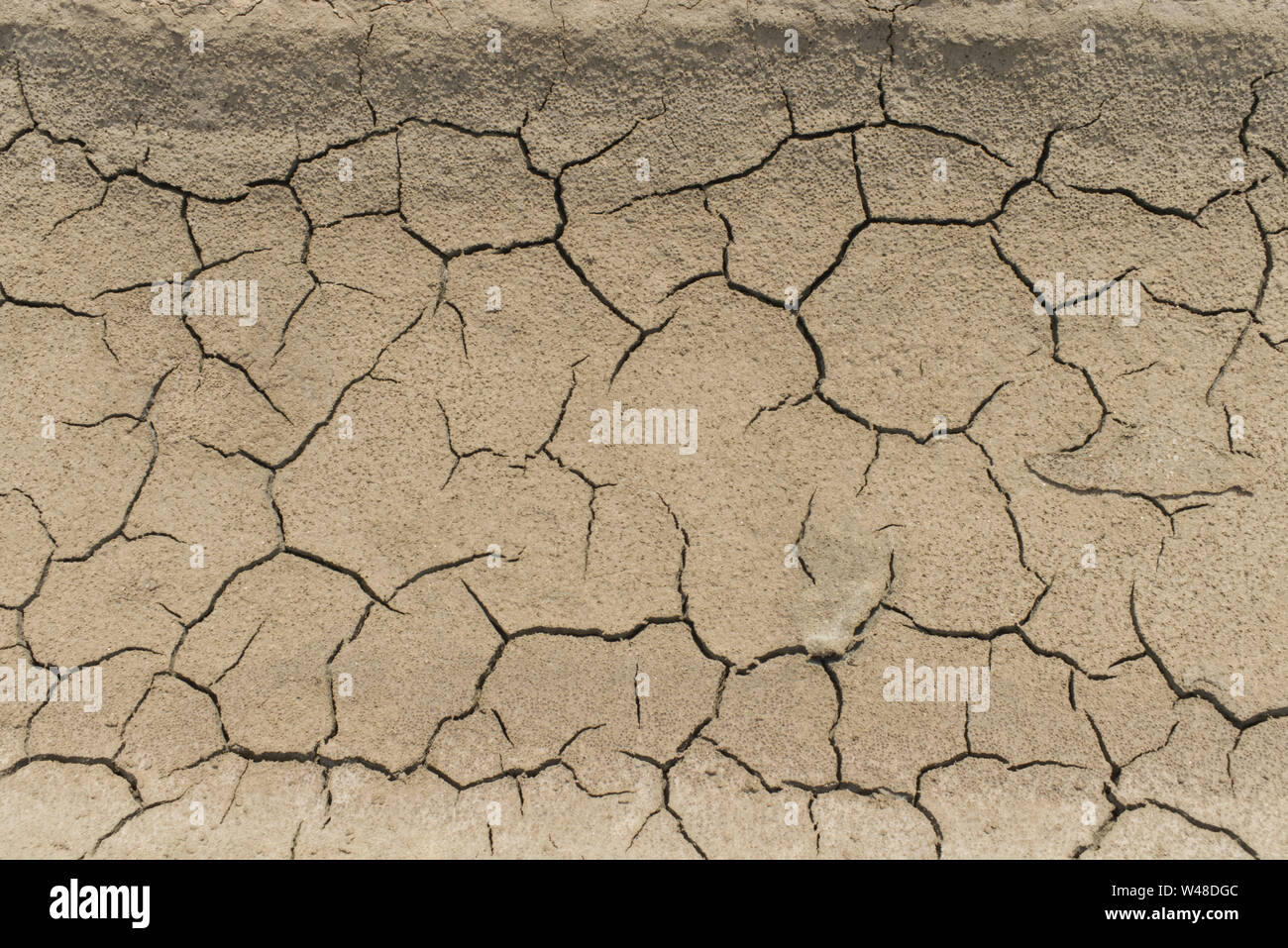 Close up texture of dry earth cracking surface from salt pan Stock ...