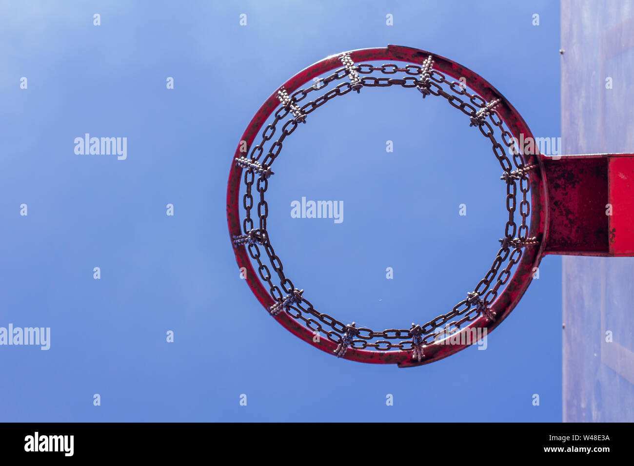Outdoor basketball ring in front of blue sky background. Sport concept ...