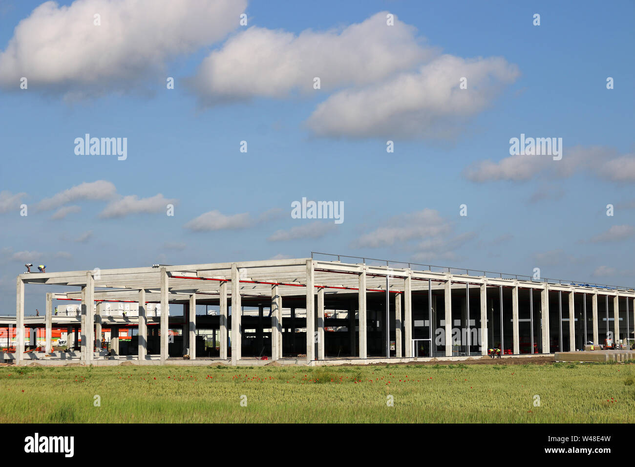 New factory construction site with workers industry Stock Photo - Alamy