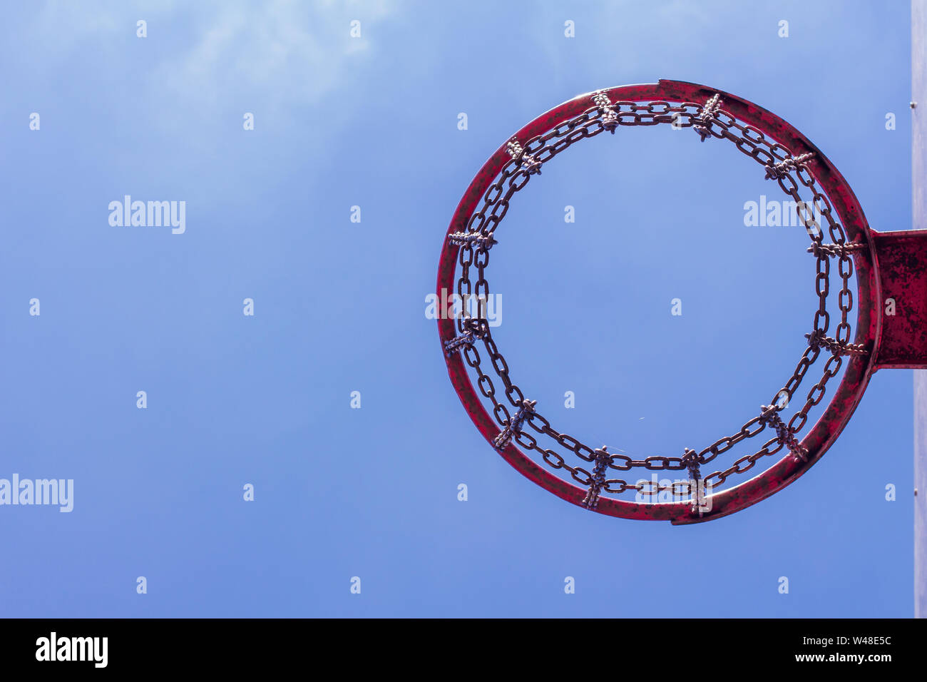 Outdoor basketball ring in front of blue sky background. Sport concept ...