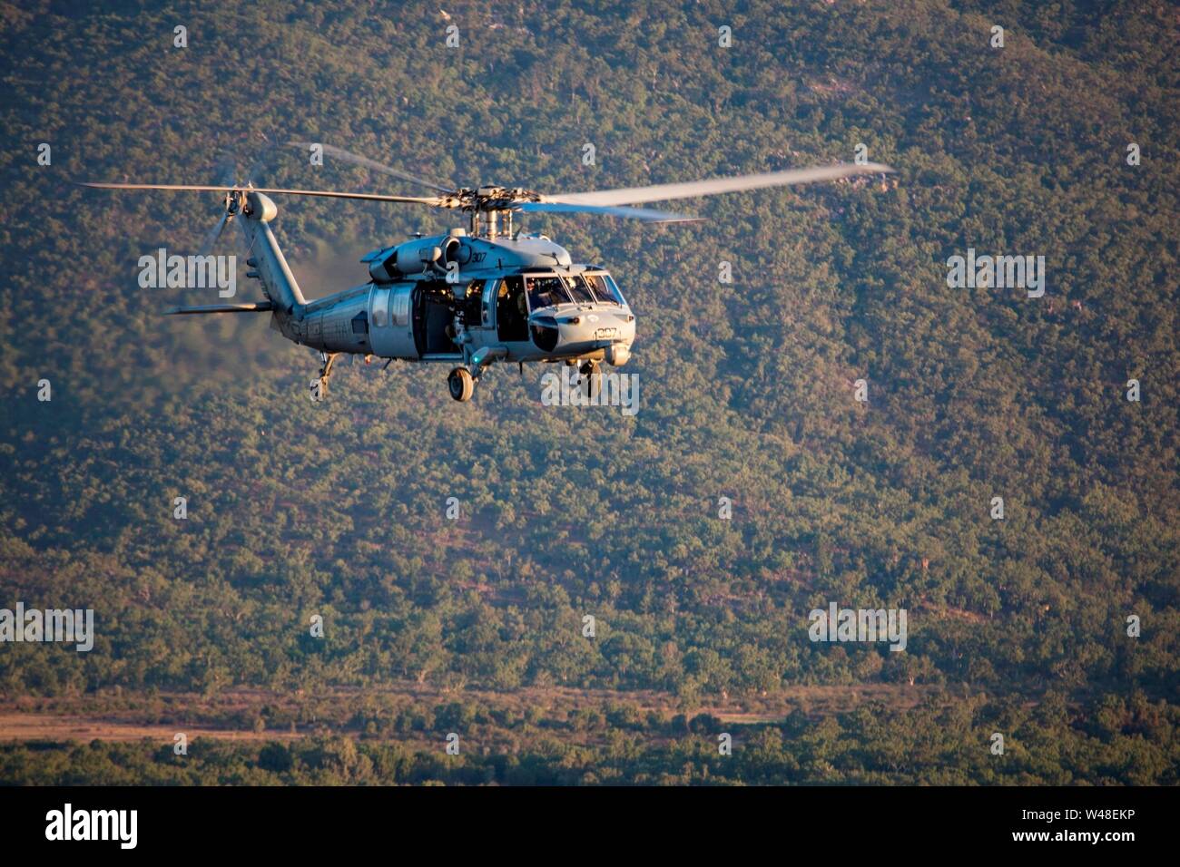 An MH-60S Seahawk with Helicopter Sea Combat Squadron 85 (HSC-85) flies ...