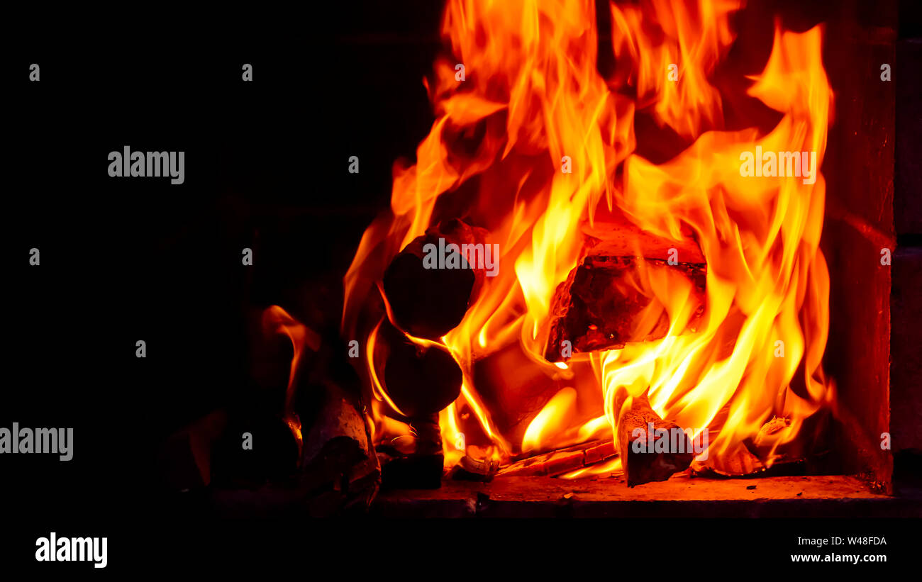 Wallpaper with a bright fire inside the brazier. Flame of fire ...