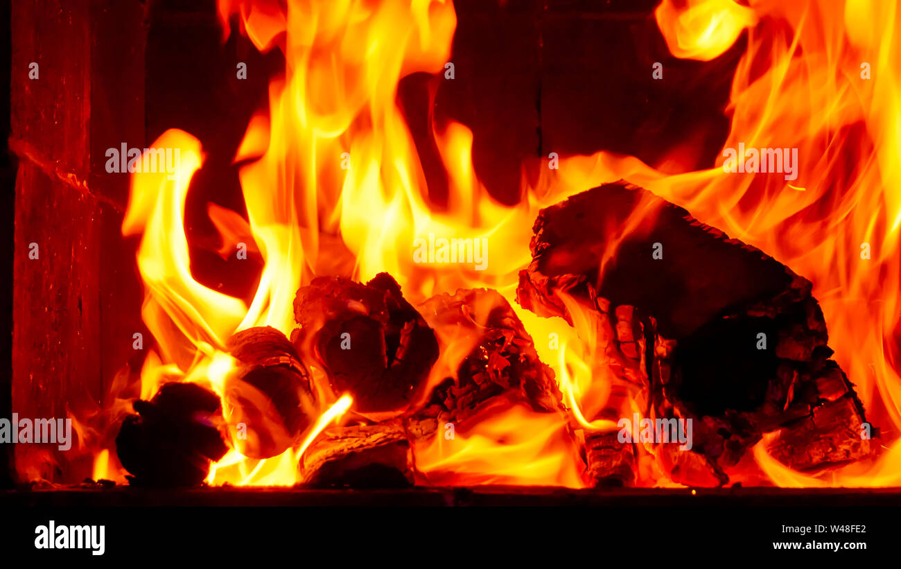 Wallpaper with a bright fire inside the brazier. Flame of fire ...