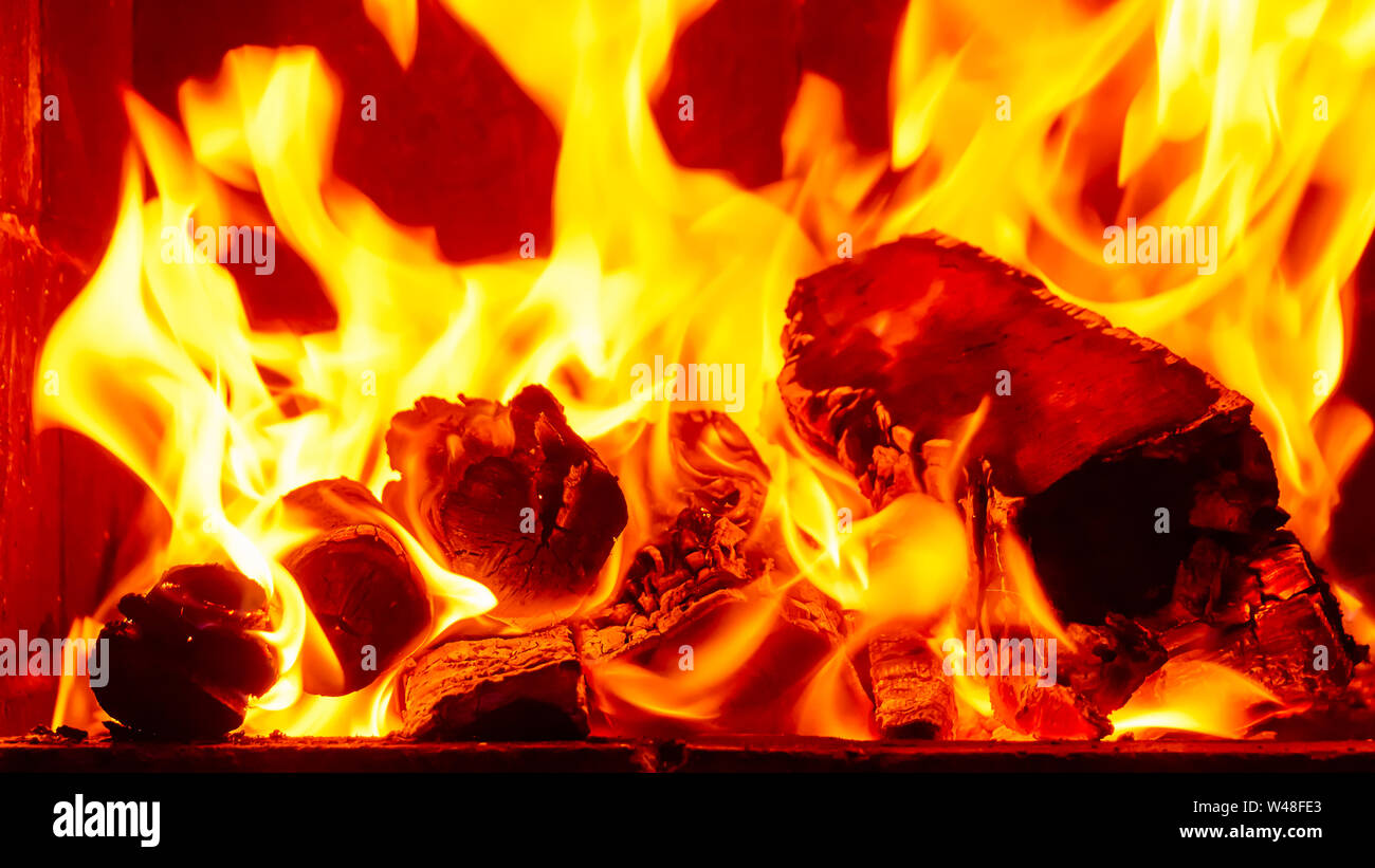 Wallpaper with a bright fire inside the brazier. Flame of fire ...