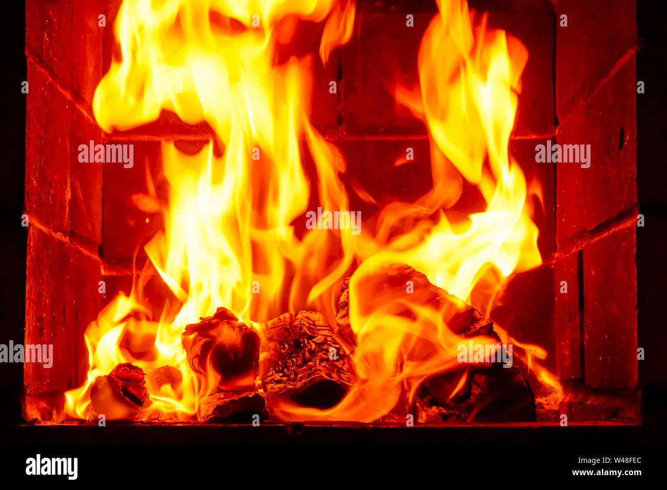 Wallpaper with a bright fire inside the brazier. Flame of fire ...