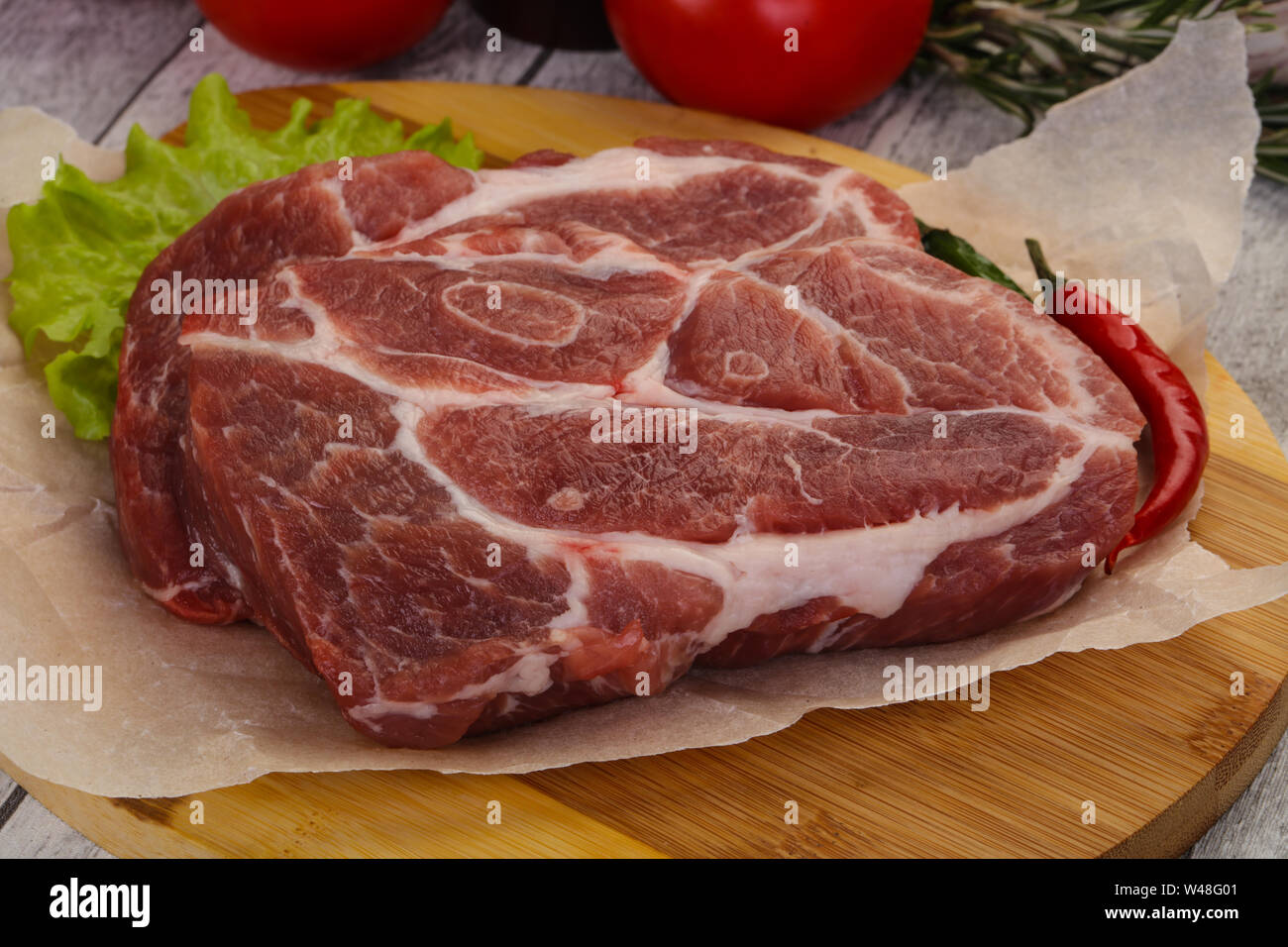 Raw pork neck steak ready for cooking Stock Photo - Alamy