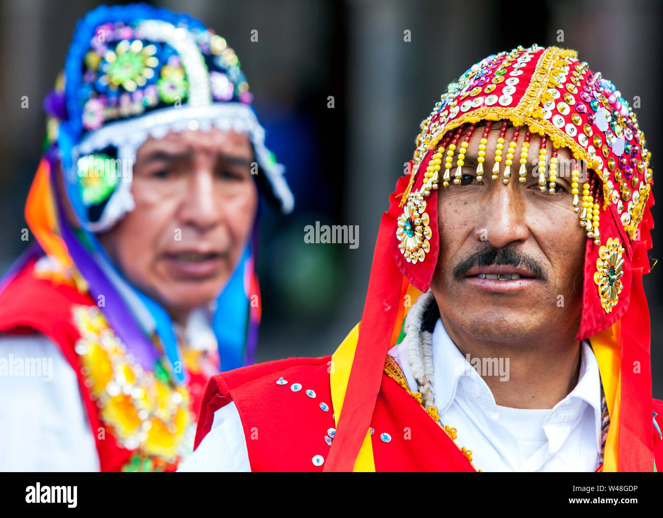 A male performer in colourful Peruvian costume dancing at Plaza de ...