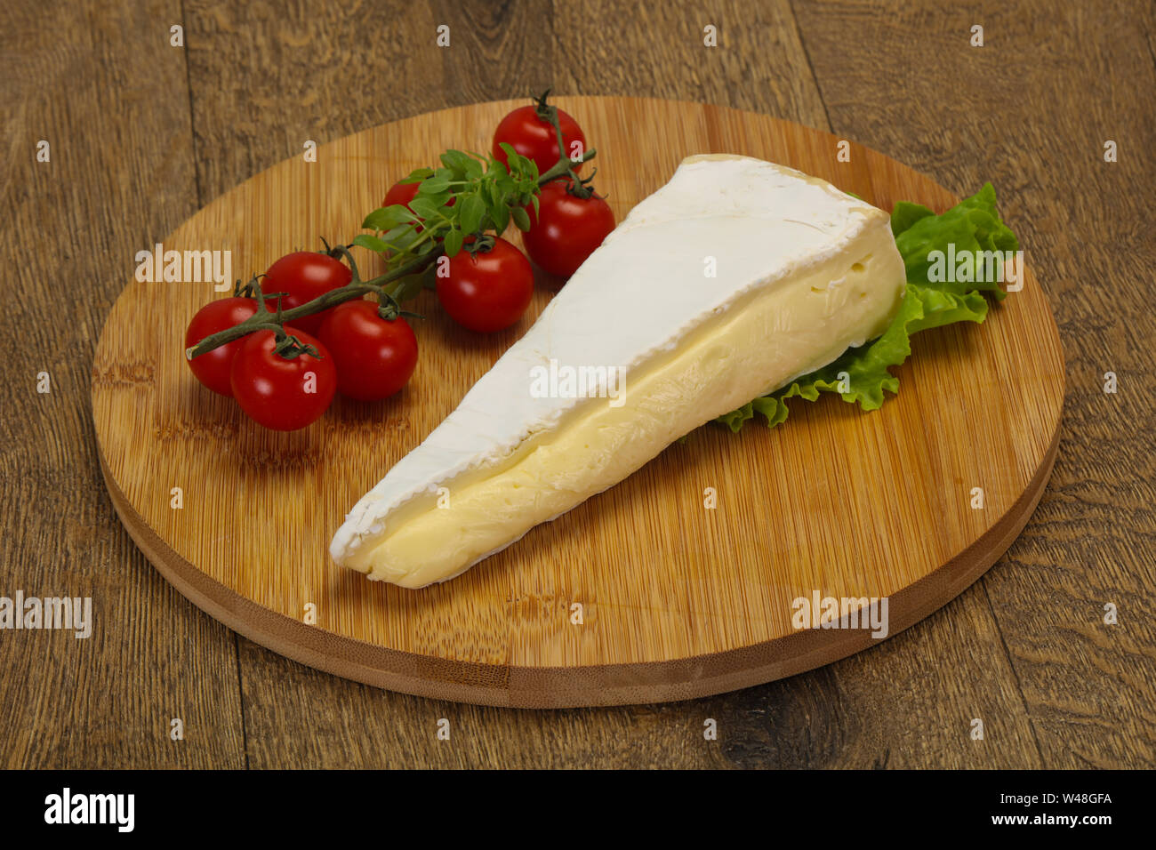 Brie cheese triangle served salad leaves Stock Photo - Alamy