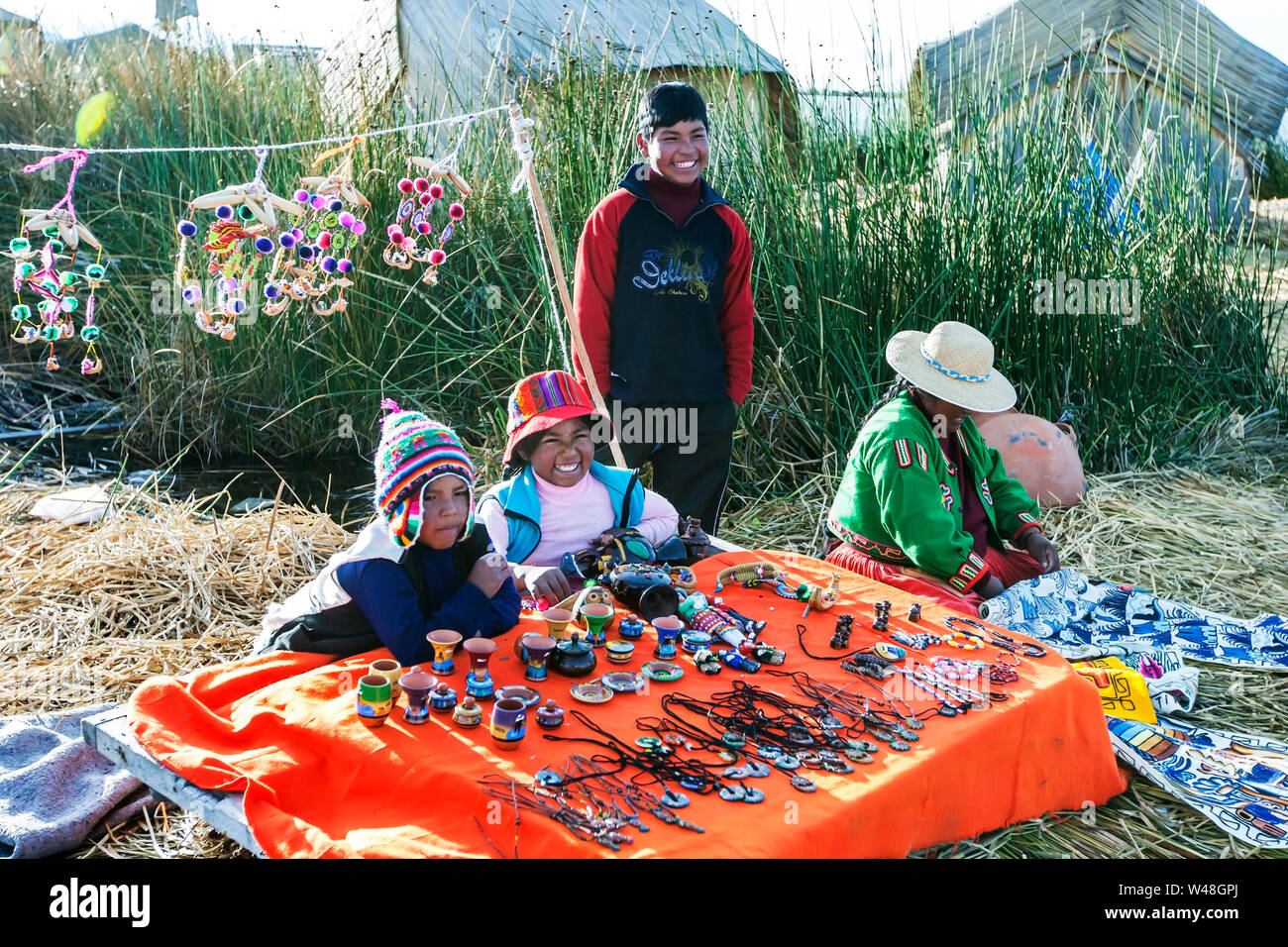 A Peruvian family who live on one of the 44 floating reed islands of ...