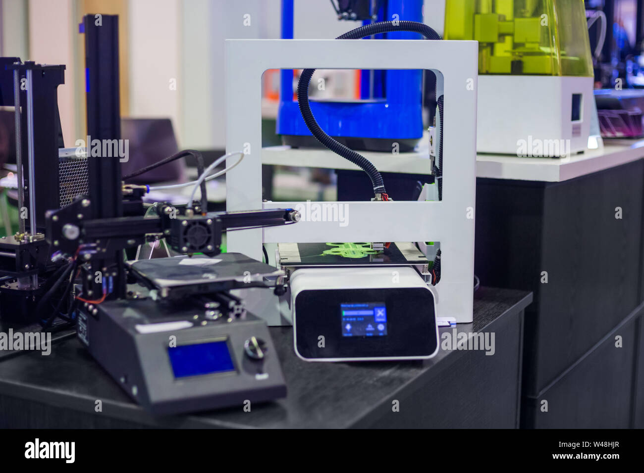 3D printing machines printing plastic model Stock Photo - Alamy