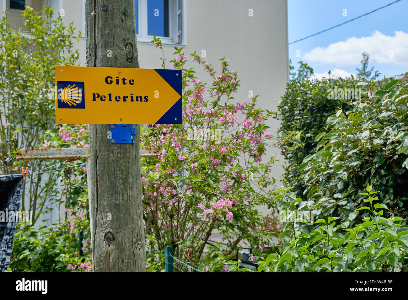 French sign pointing to a Pilgrim Hostel (Gite Pelerins) attached to a ...