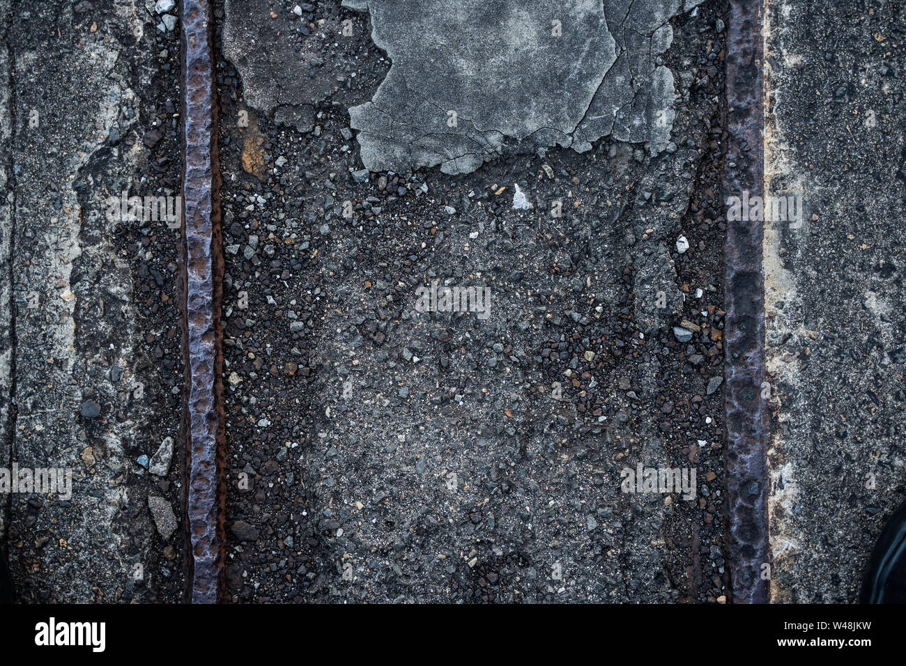 Dark concrete texture with old rail road line background graphic asset ...