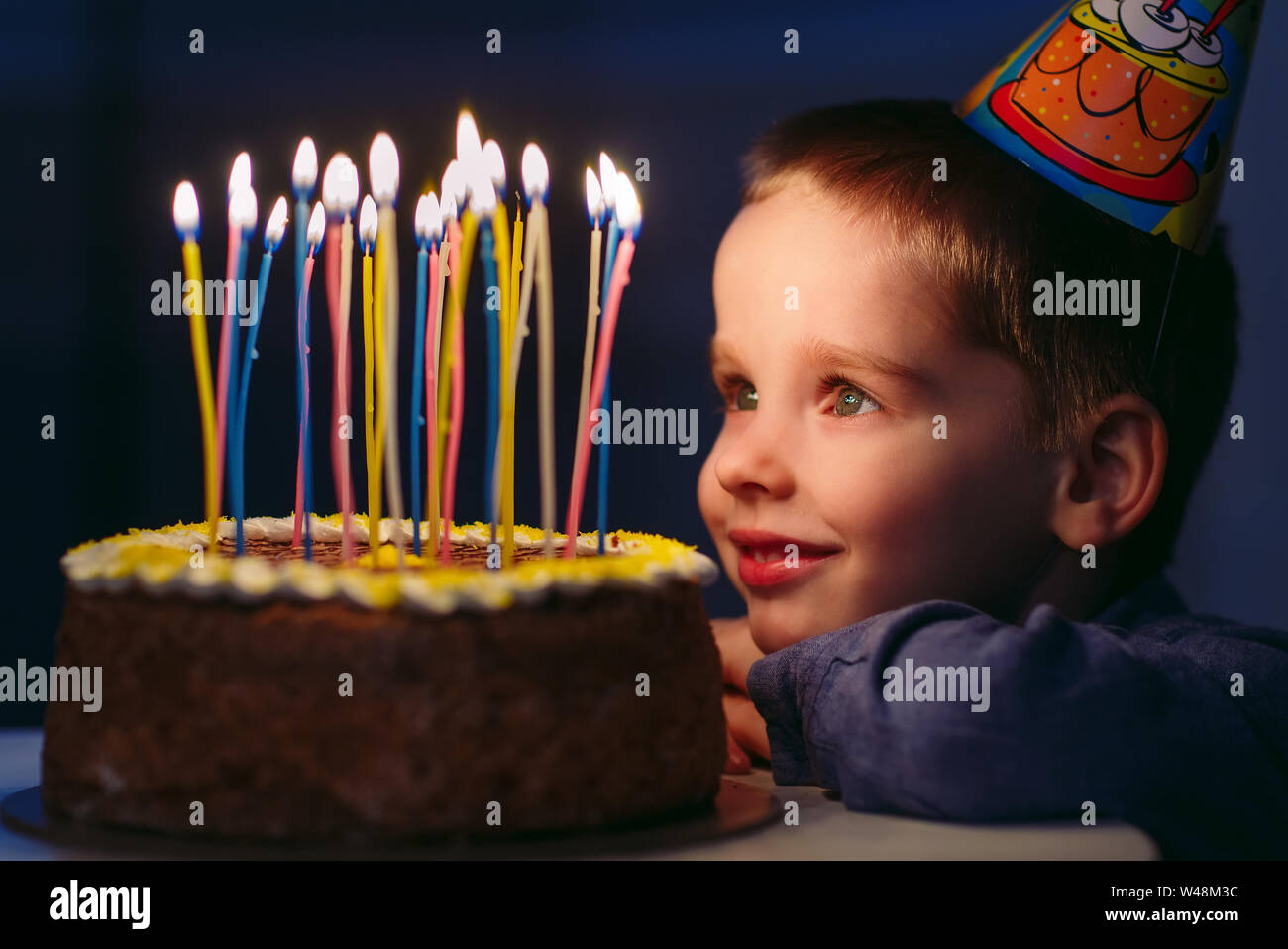 Birthday. A little boy blows out candles on the stoke Stock Photo - Alamy