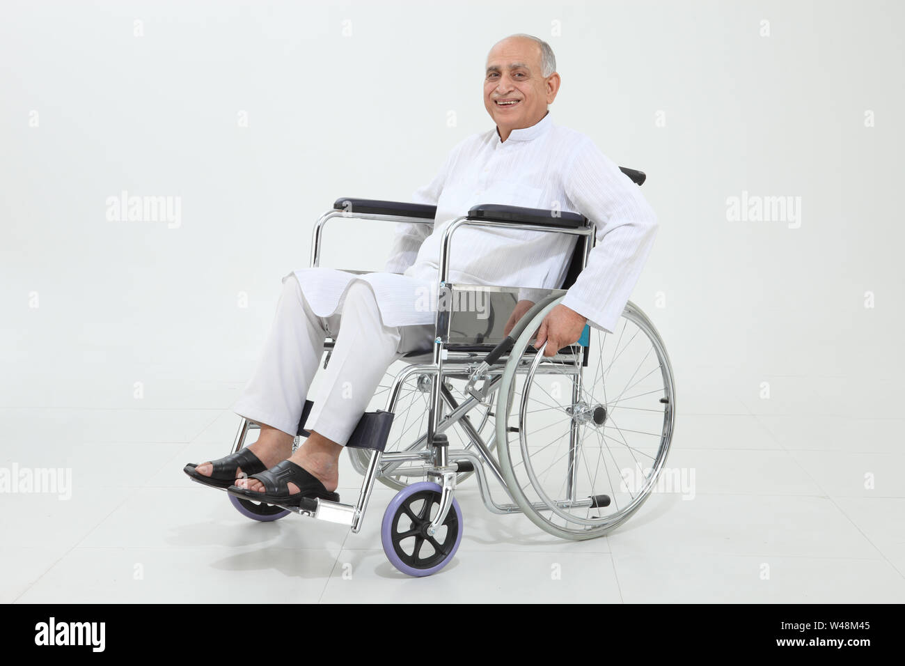 Senior man smiling in a wheelchair Stock Photo - Alamy