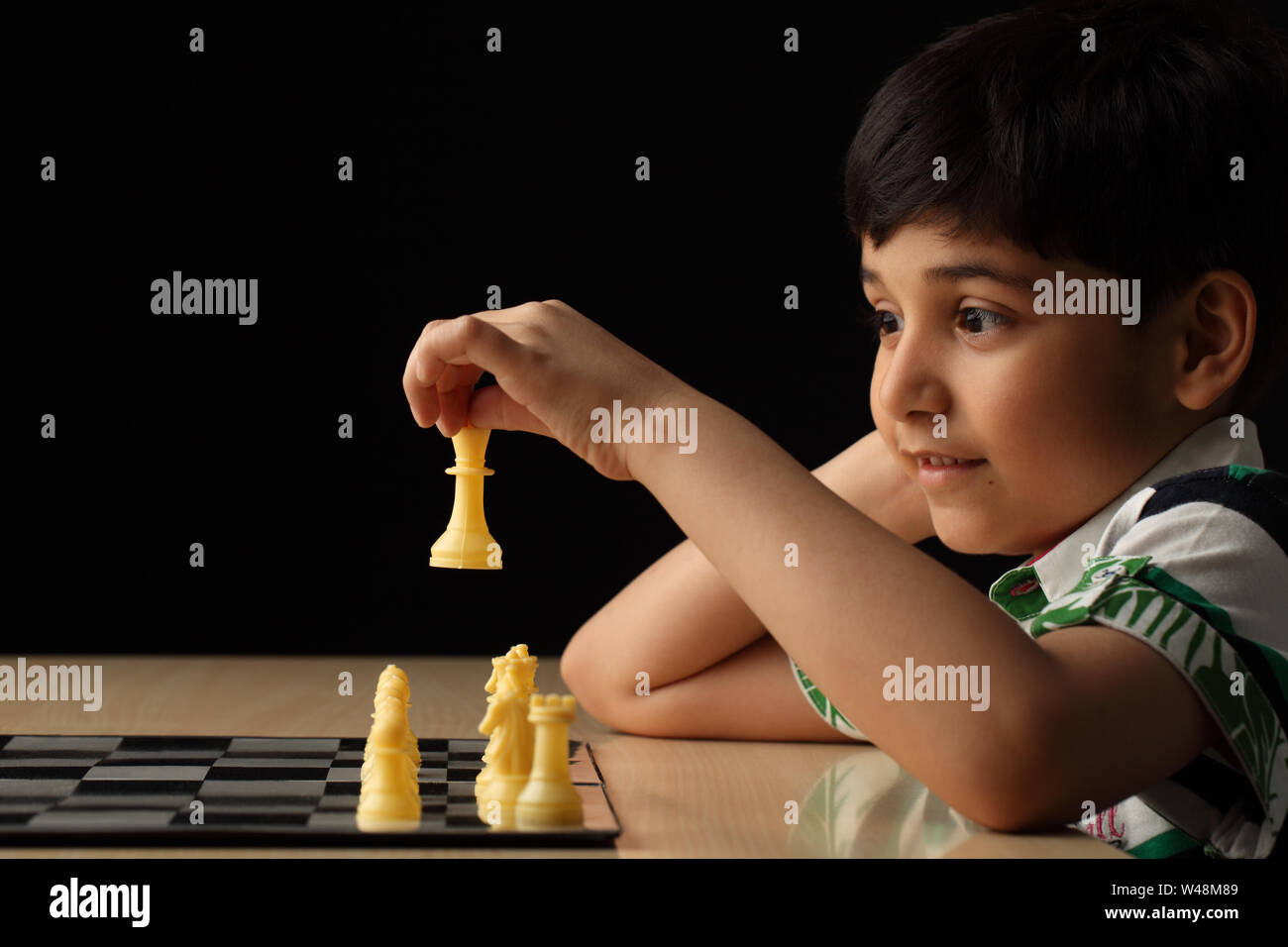 Boy playing chess Stock Photo - Alamy