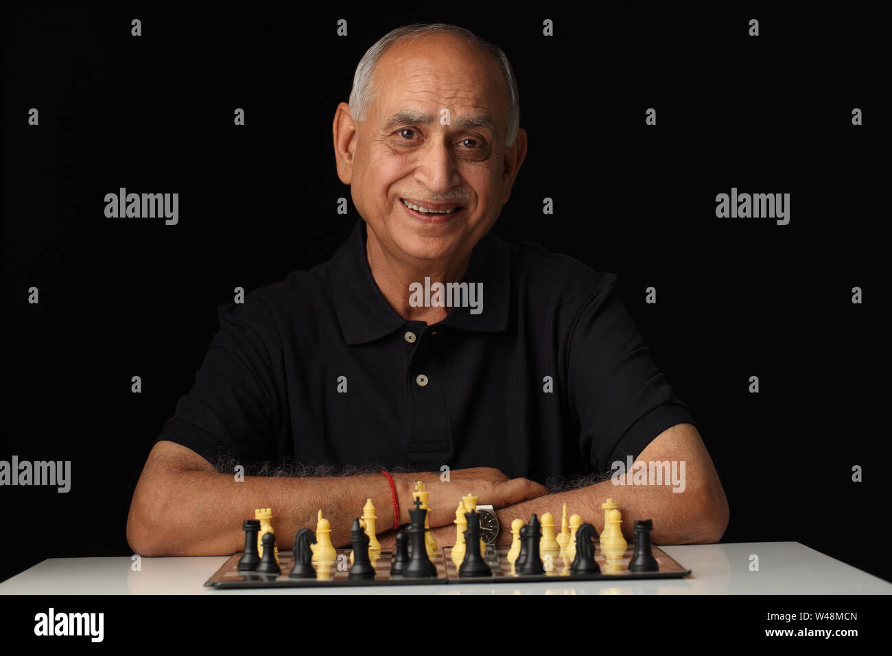 Senior man playing chess Stock Photo - Alamy