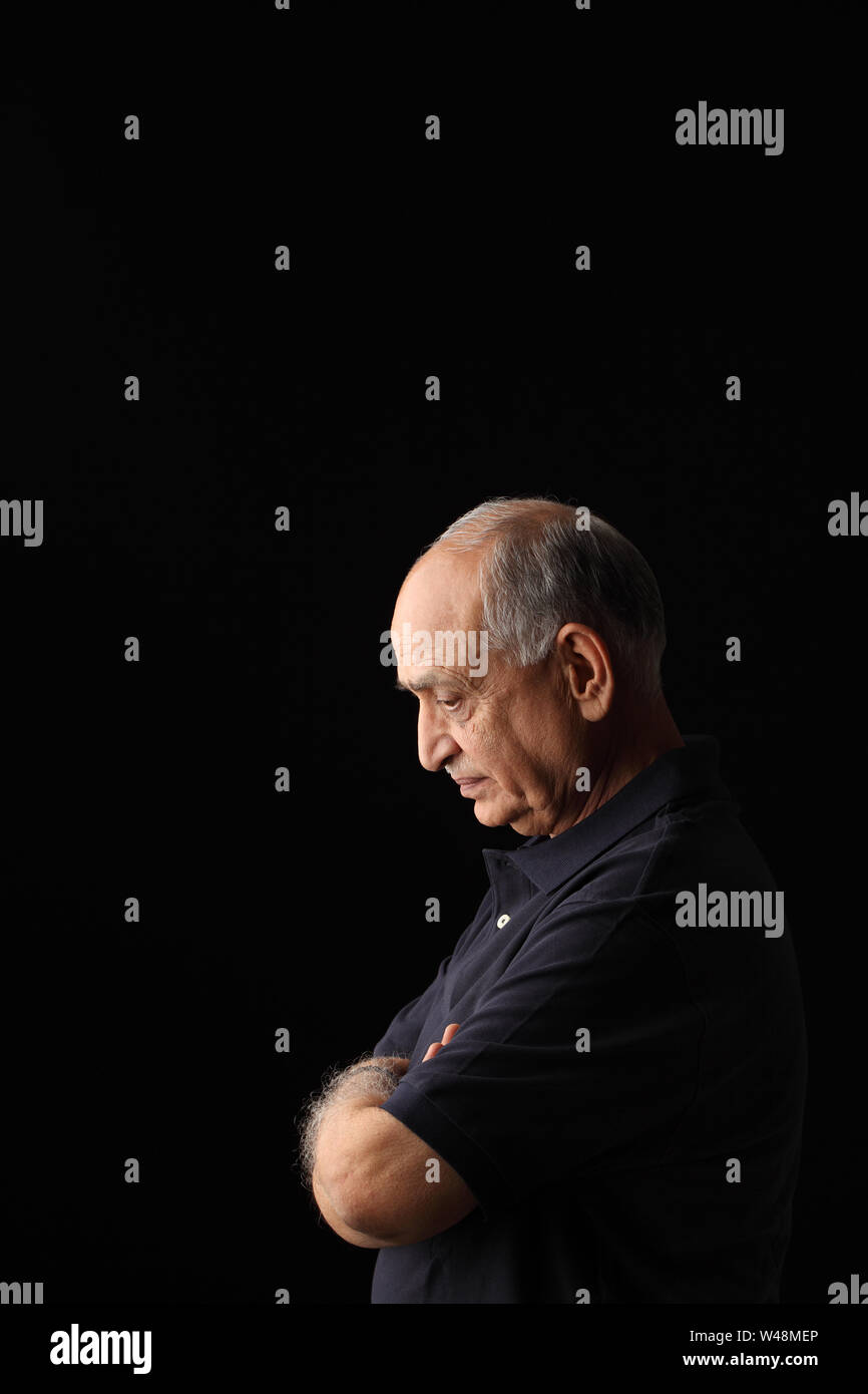 Senior man looking depressed Stock Photo - Alamy