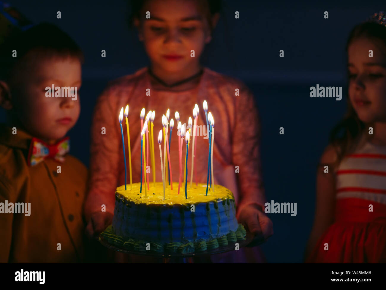 Children's birthday. Children near a birthday cake with candles Stock ...