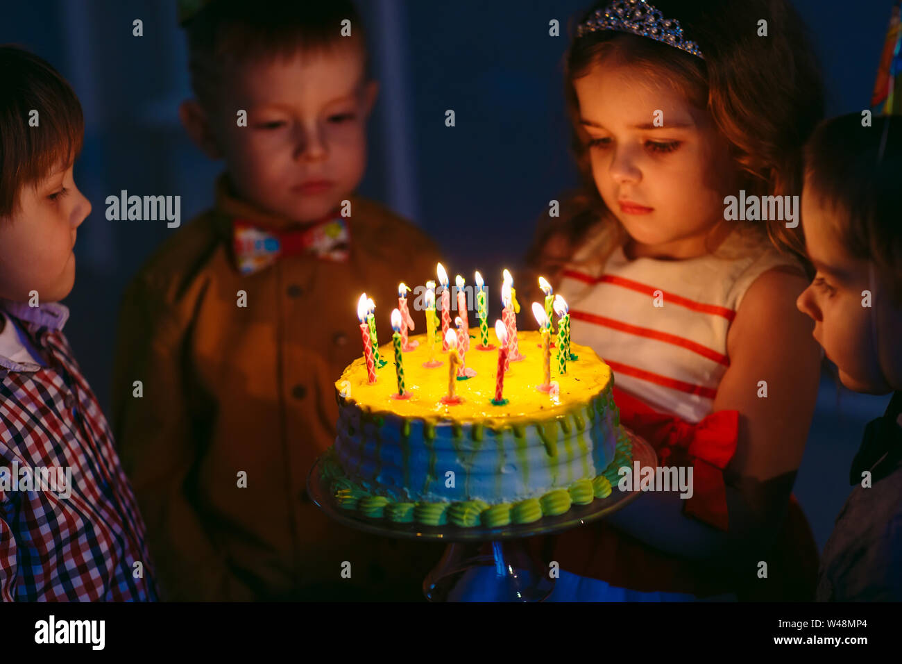 Children's birthday. Children near a birthday cake with candles Stock ...