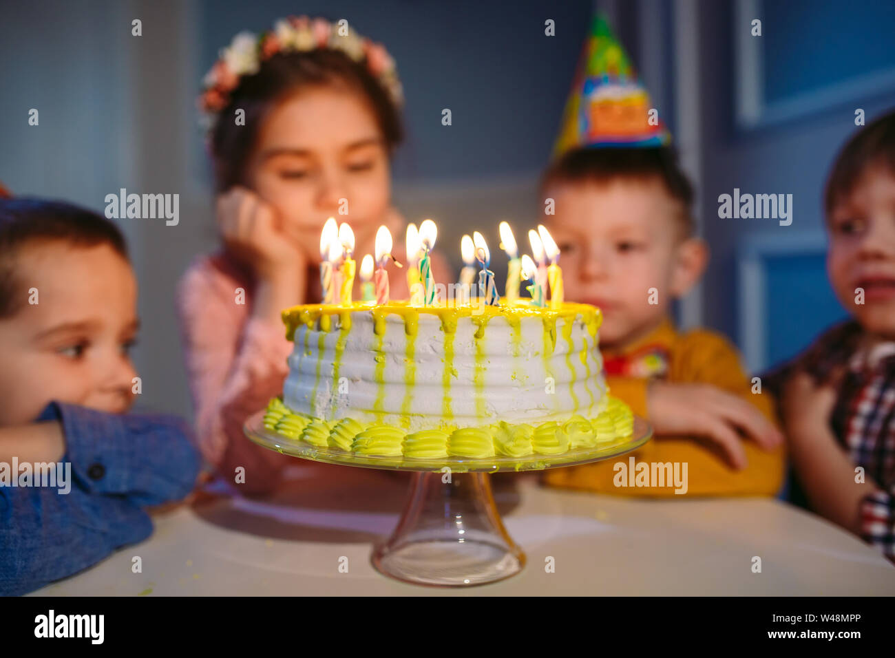 Children's birthday. Children near a birthday cake with candles Stock ...