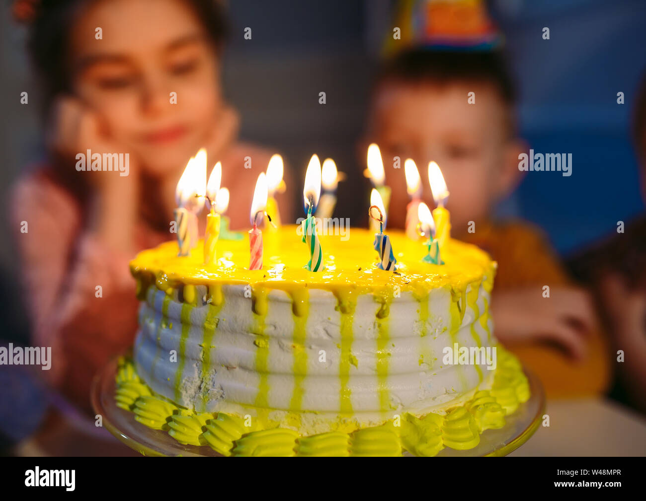 Children's birthday. Children near a birthday cake with candles Stock ...