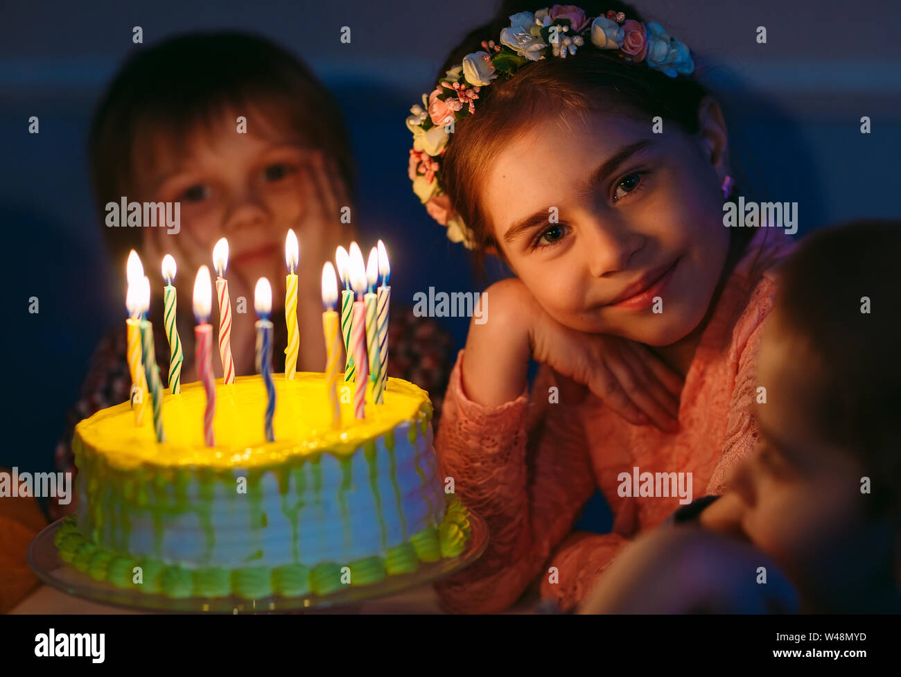 Children's birthday. Children near a birthday cake with candles Stock ...