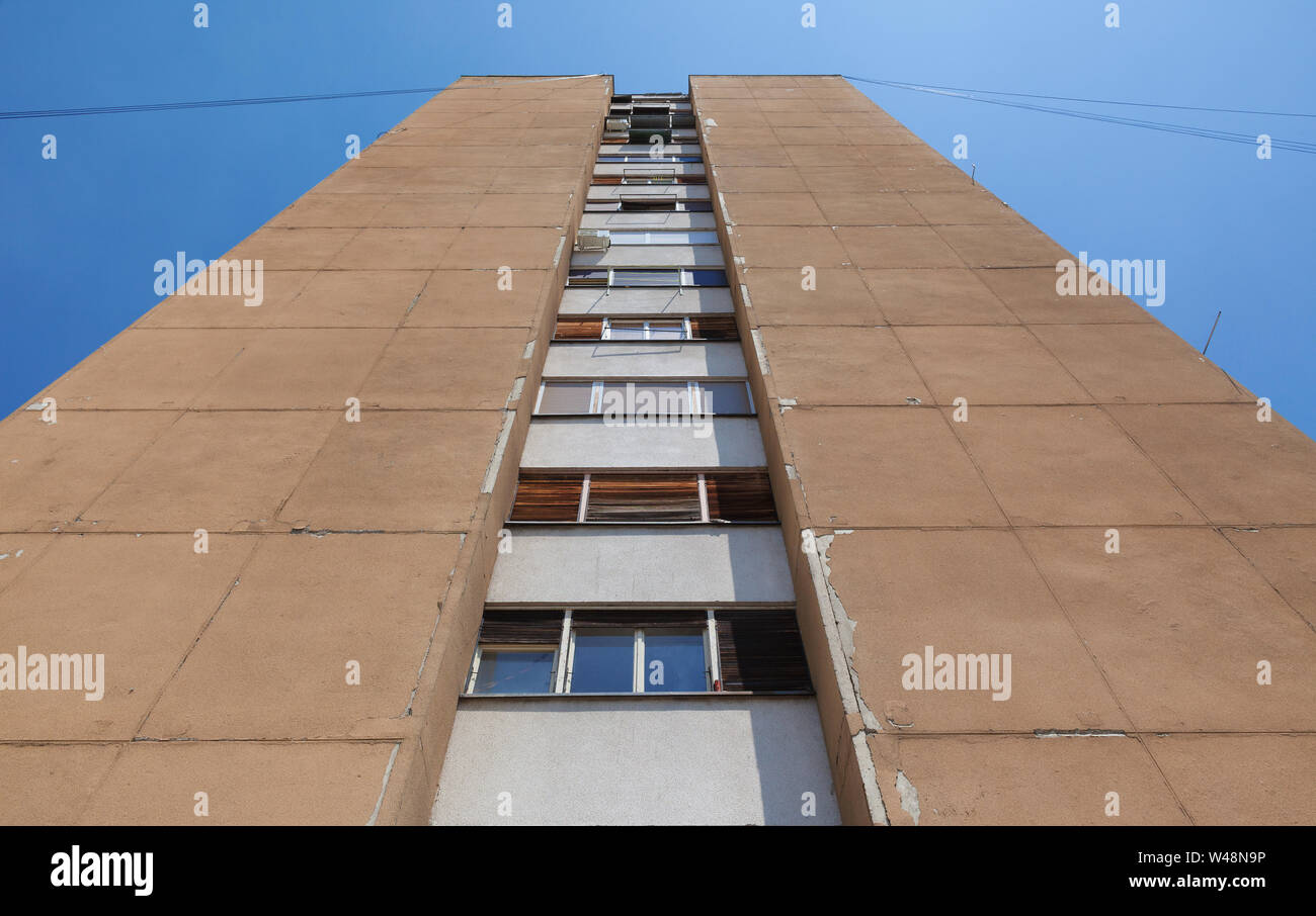 Old building exterior, blue sky in background, viewed from the ground ...