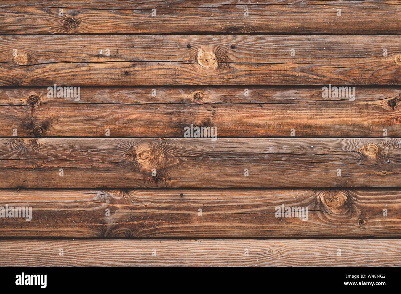 Old cracked wooden boards, brown planks. Surface of shabby weathered ... Old cracked wooden boards, brown planks. Surface of shabby weathered ...