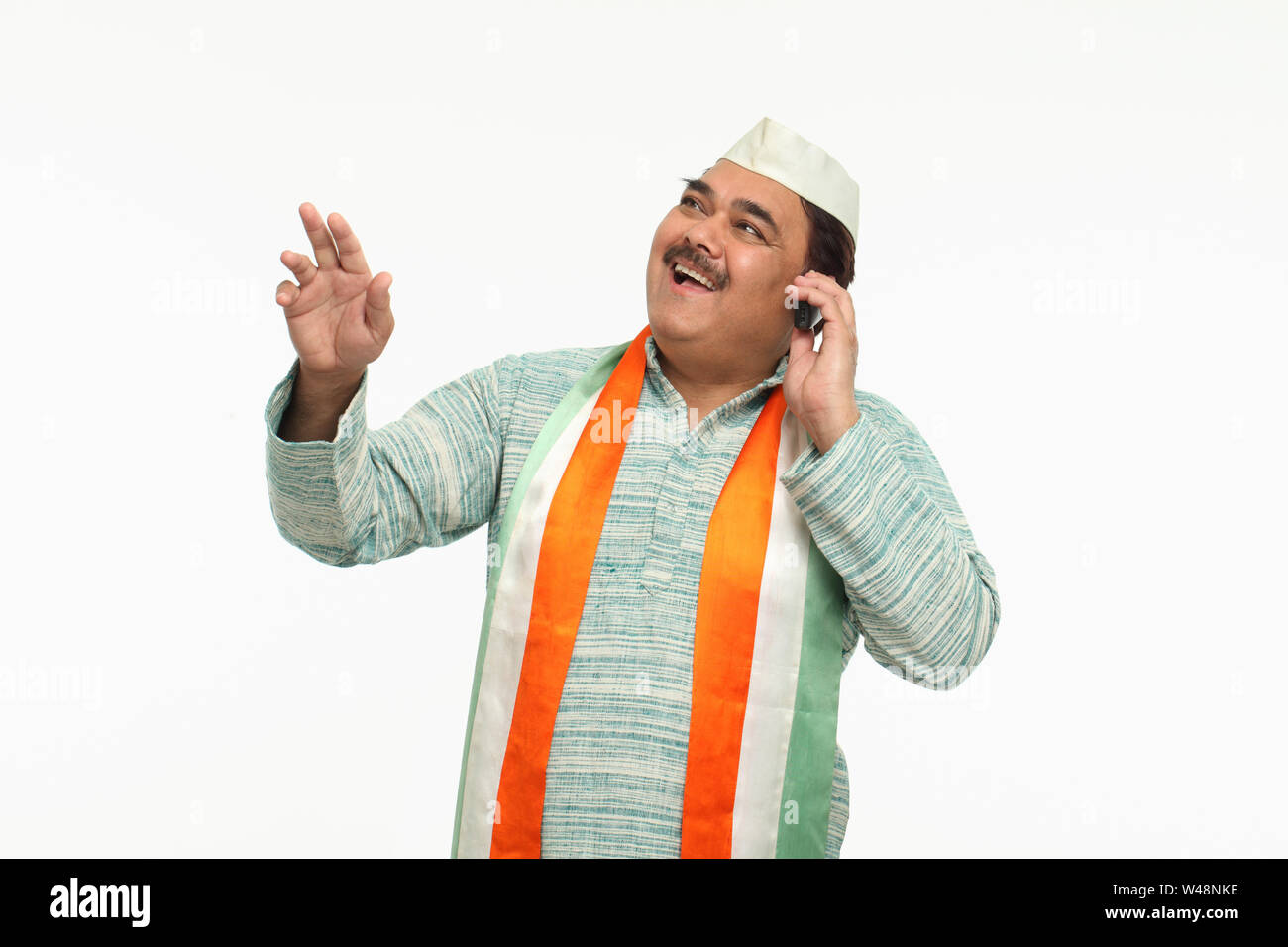 Politician talking on mobile phone and laughing Stock Photo - Alamy