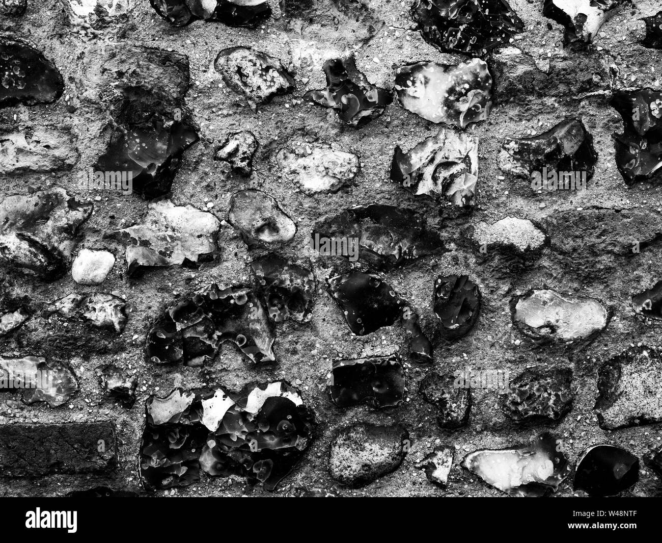 A background texture of a flint wall Stock Photo - Alamy