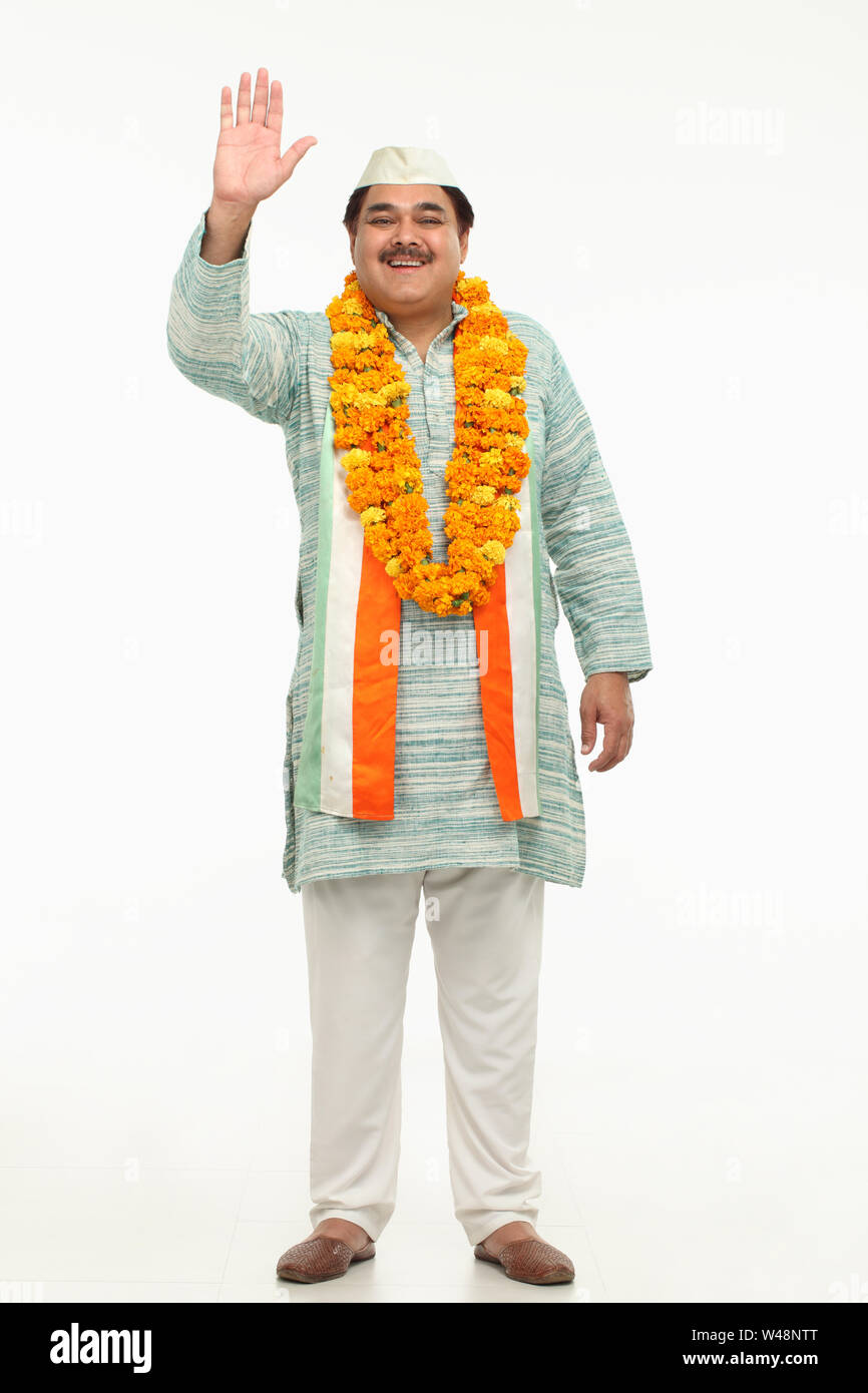 Portrait of a politician waving hand Stock Photo - Alamy