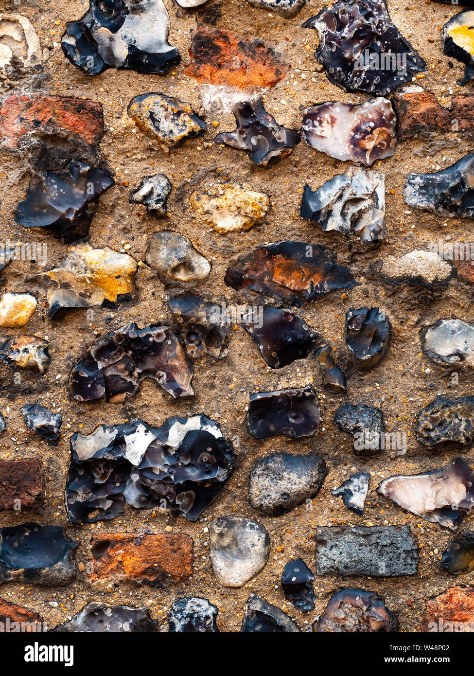 A background texture of a flint wall Stock Photo - Alamy