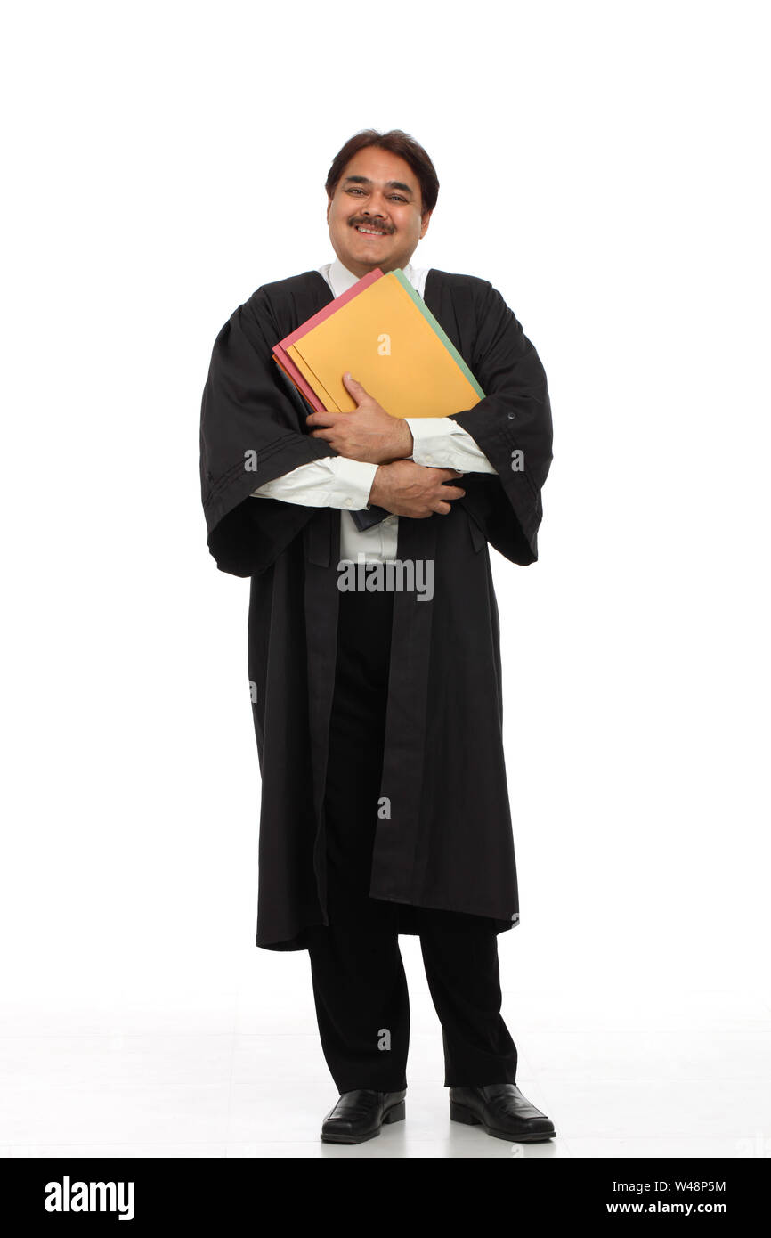 Lawyer standing with files and smiling Stock Photo - Alamy