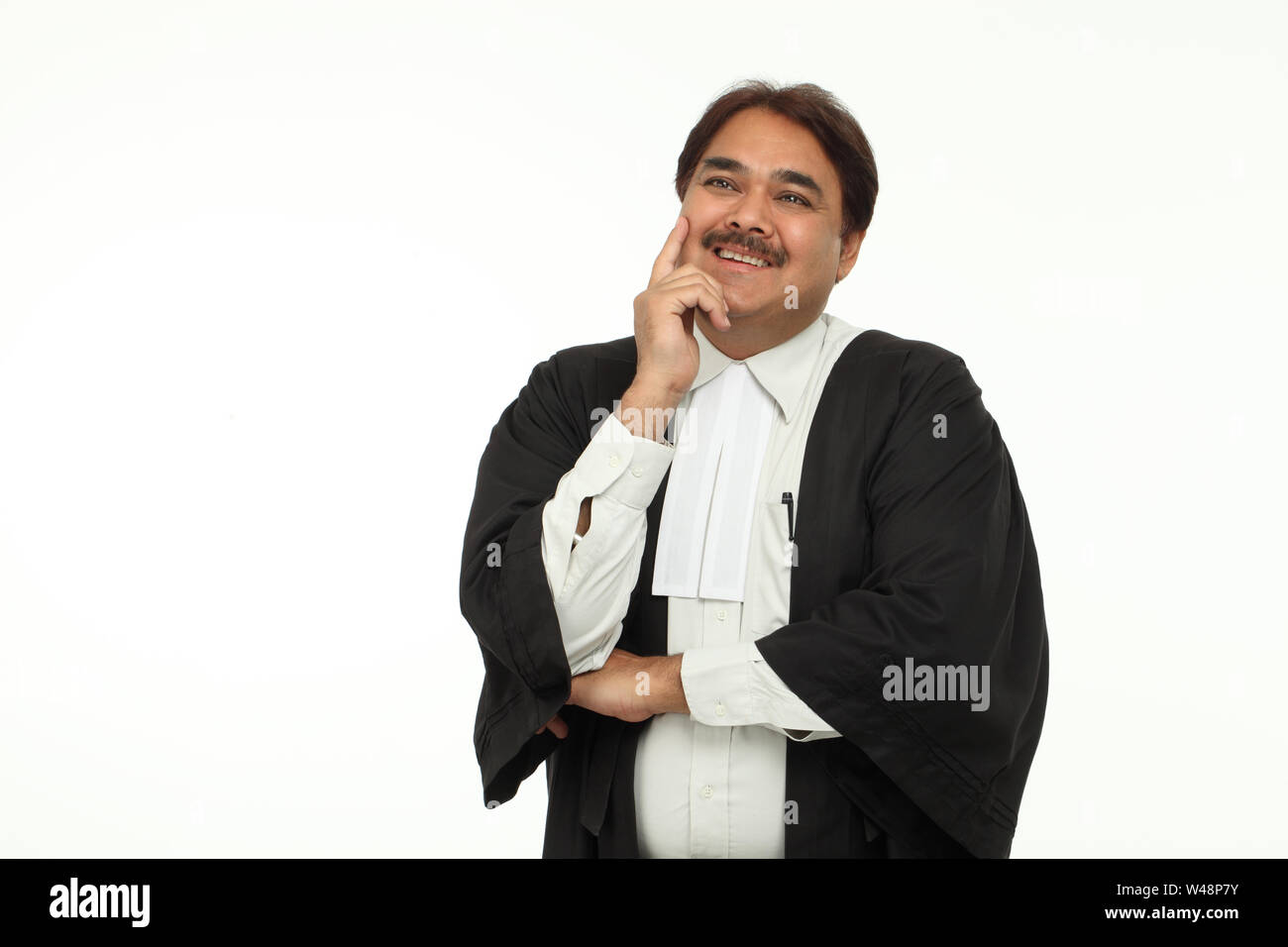 Indian lawyer day dreaming and smiling Stock Photo - Alamy