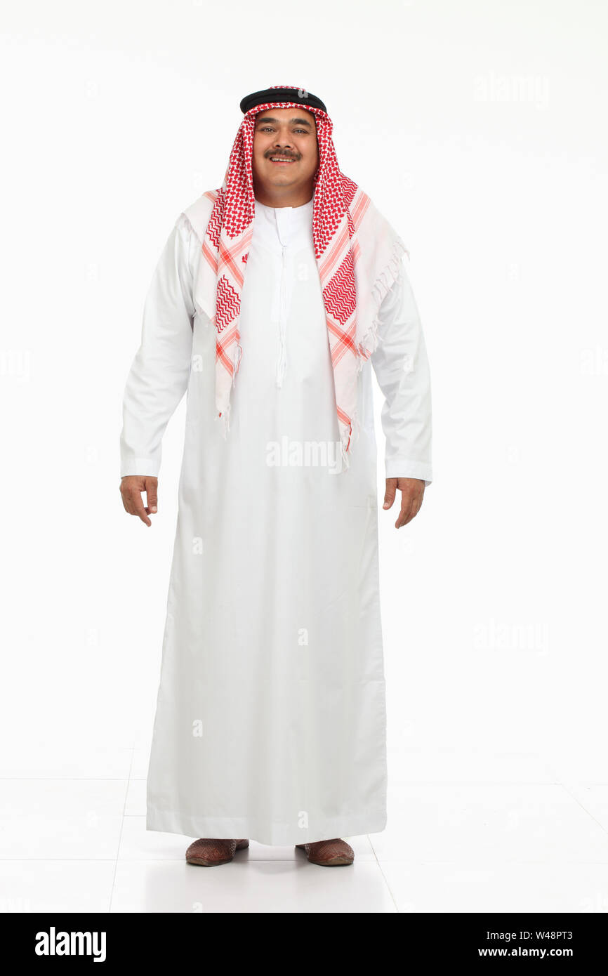 Arabian man standing and smiling Stock Photo - Alamy