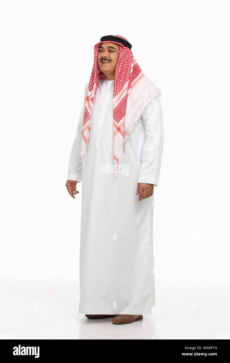 Arabian man standing and smiling Stock Photo - Alamy