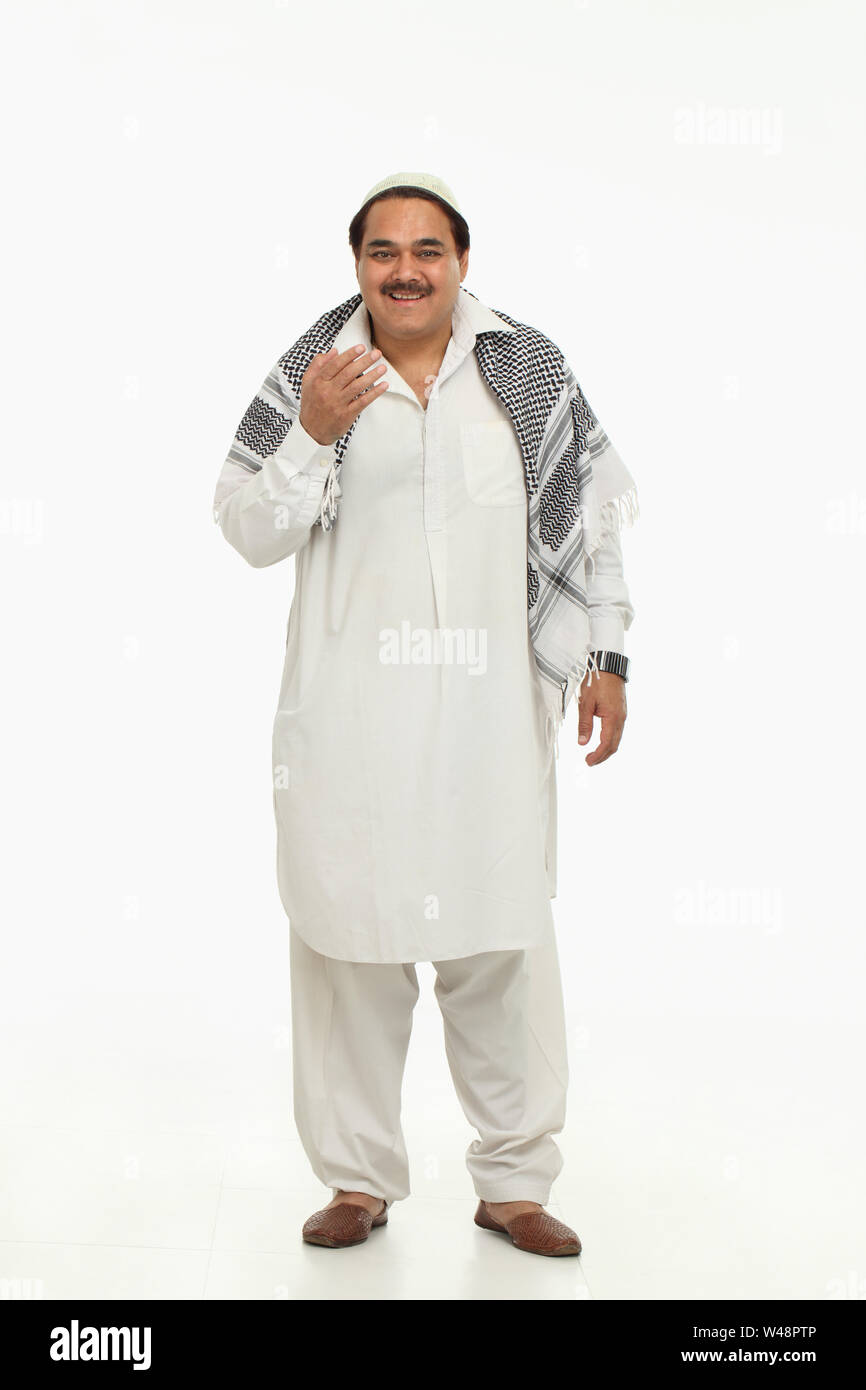 Muslim man greeting and smiling Stock Photo - Alamy
