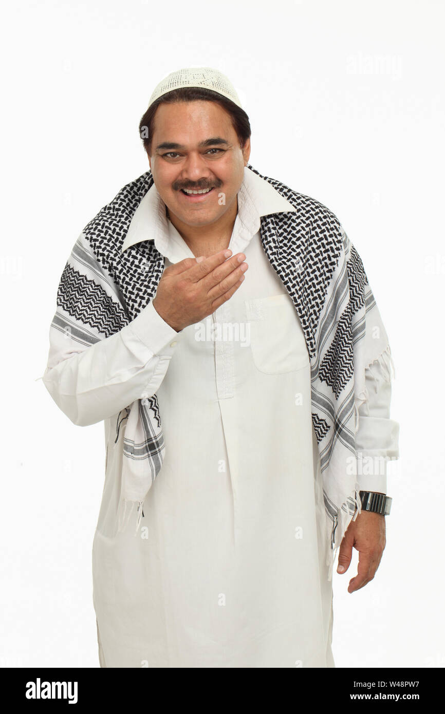 Portrait of a Muslim man greeting Stock Photo - Alamy
