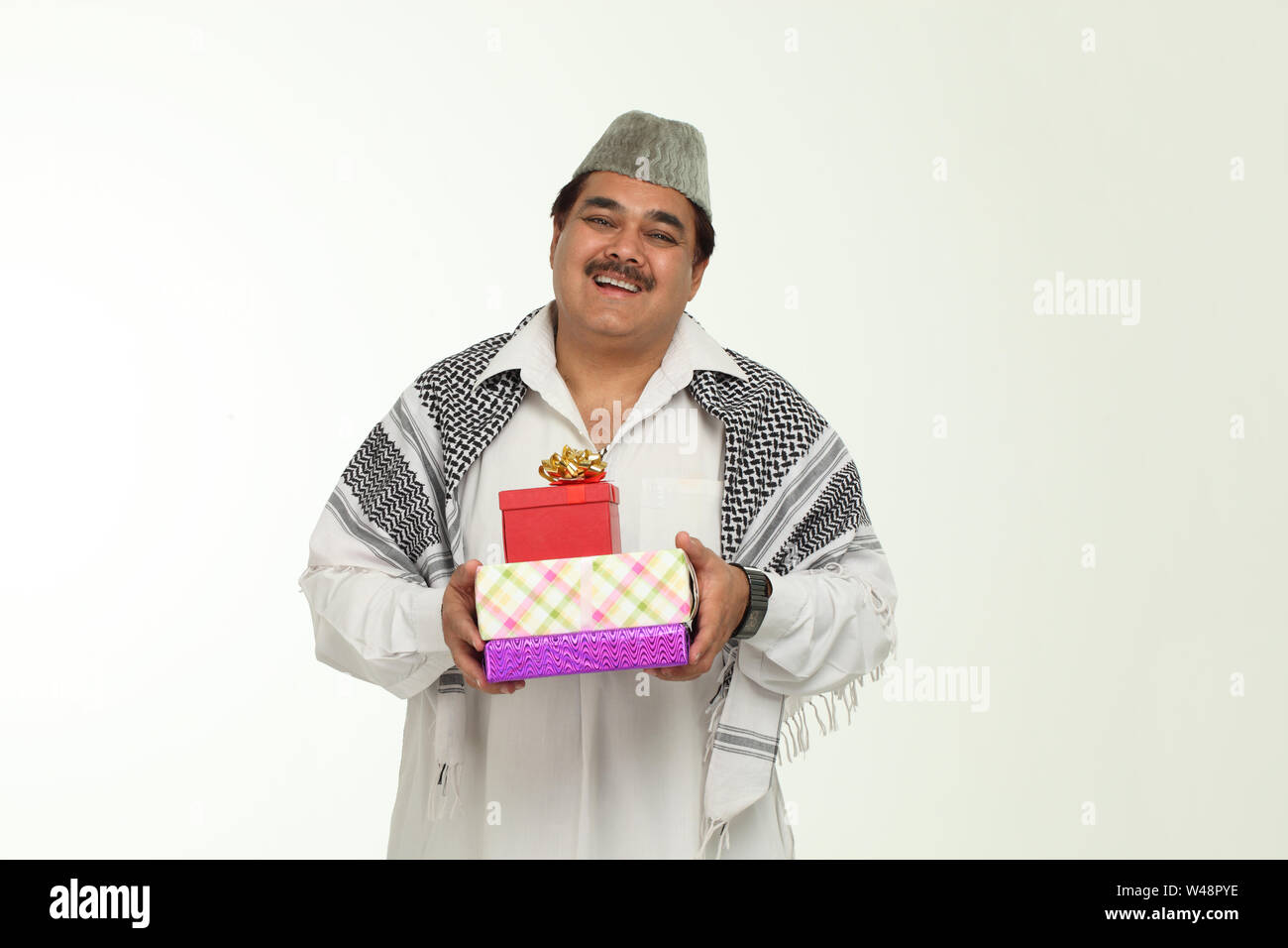 Muslim man holding gift box hi-res stock photography and images - Alamy