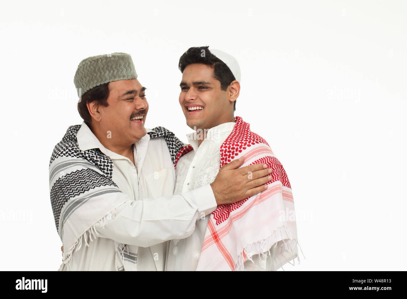 Man hugging his son and smiling Stock Photo - Alamy