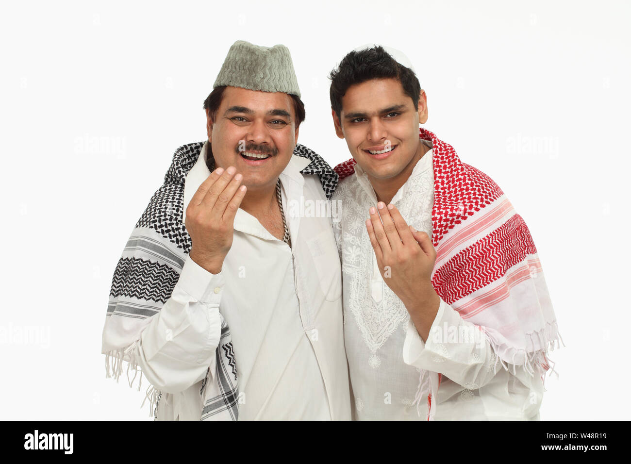 Portrait of two Muslim men greeting Stock Photo - Alamy