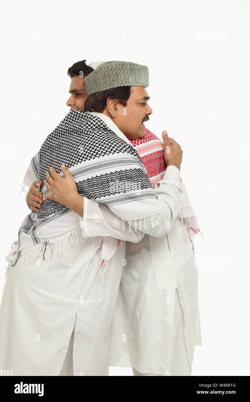 Muslim man hugging his son Stock Photo - Alamy