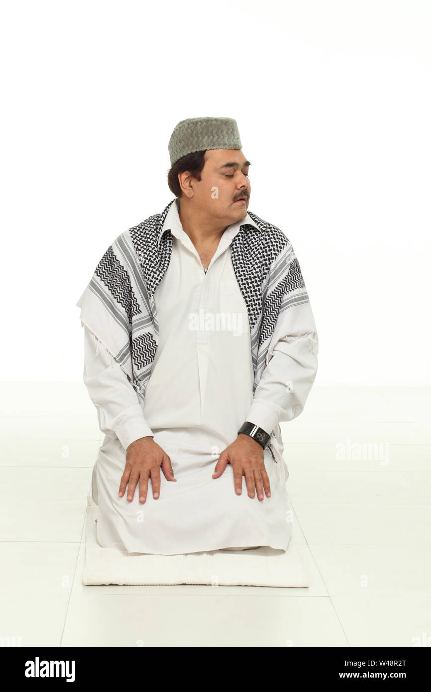 Muslim man praying namaz Stock Photo - Alamy